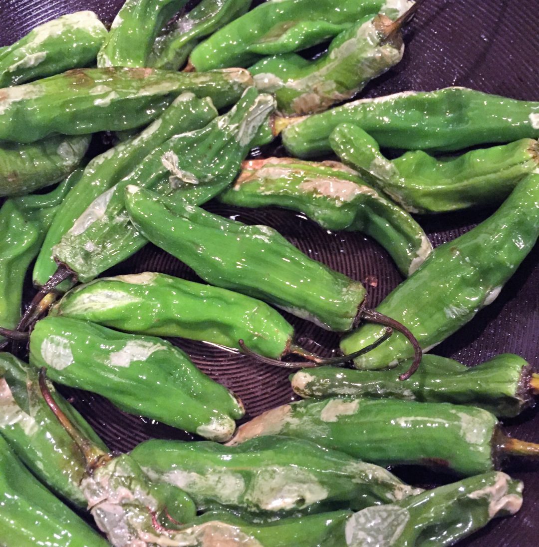 Blistered shishito peppers to serve as a hot appetizer